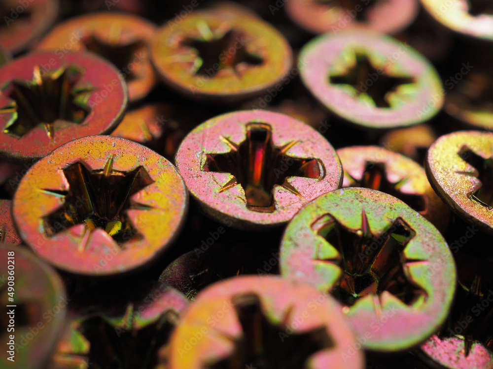 Anodized screw caps close-up. A vivid illustration on the theme of ...