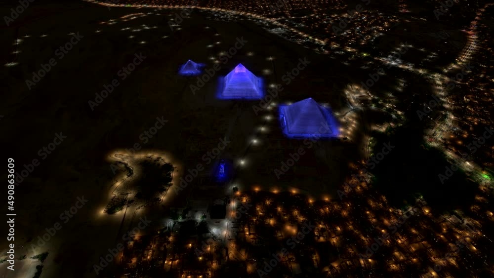 Aerial night view of pyramids in Egypt Cairo are structures whose outer ...