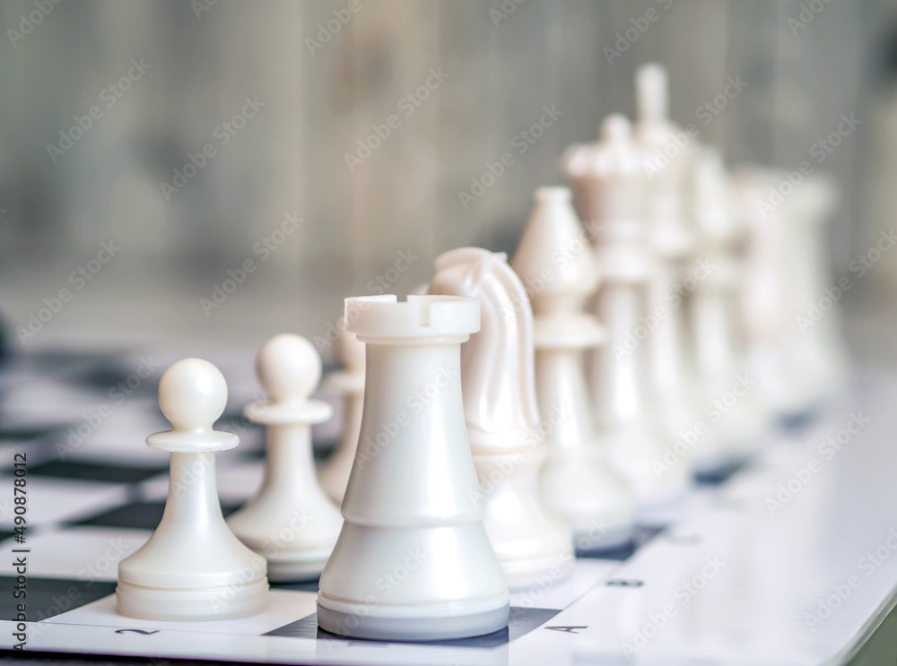 White chess pieces are in the correct order on the chess board ...