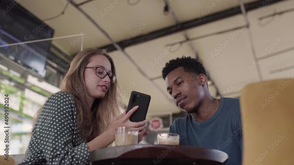 Friends in a cafe bar. Multiethnic business colleagues having a meeting ...