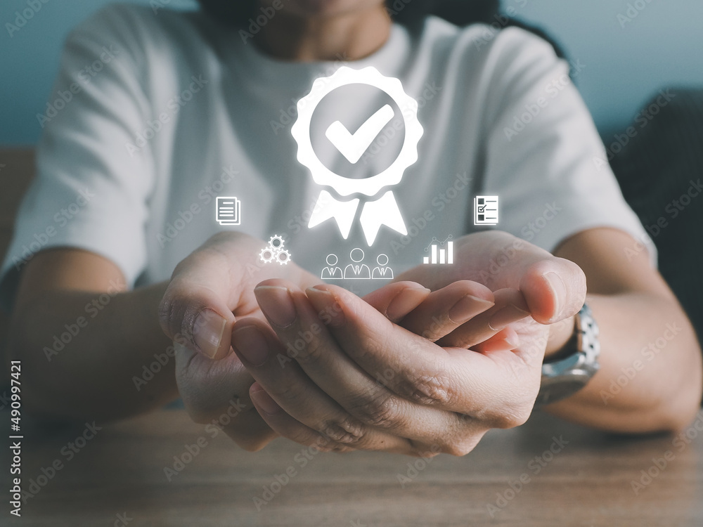 hand showing sign quality assurance ISO certification and associated ...