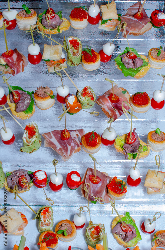 slicing vegetables in portions on a buffet table top view Stock Photo ...