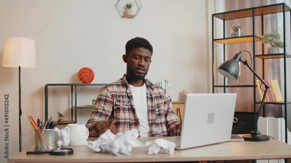 Angry furious man working at home office throwing crumpled paper ...
