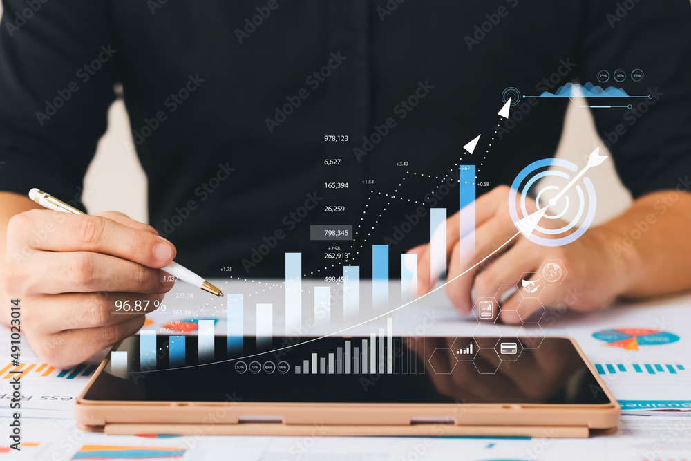 Businessman analyzing company's financial balance sheet working with ... Businessman analyzing company's financial balance sheet working with ...
