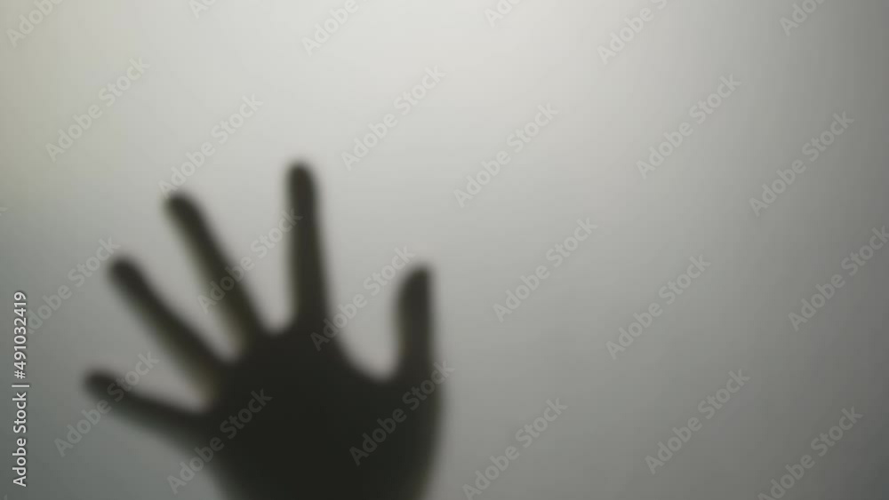shadow people hand or human palm try to hits and breaks smashing on ...