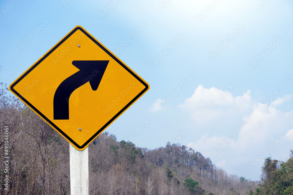 Yellow traffic sign with arrow right curve symbol to warn drivers to ...