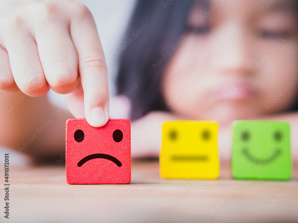 Little Asia child girl choose unhappy, sad, upset face, blurred neutral ...