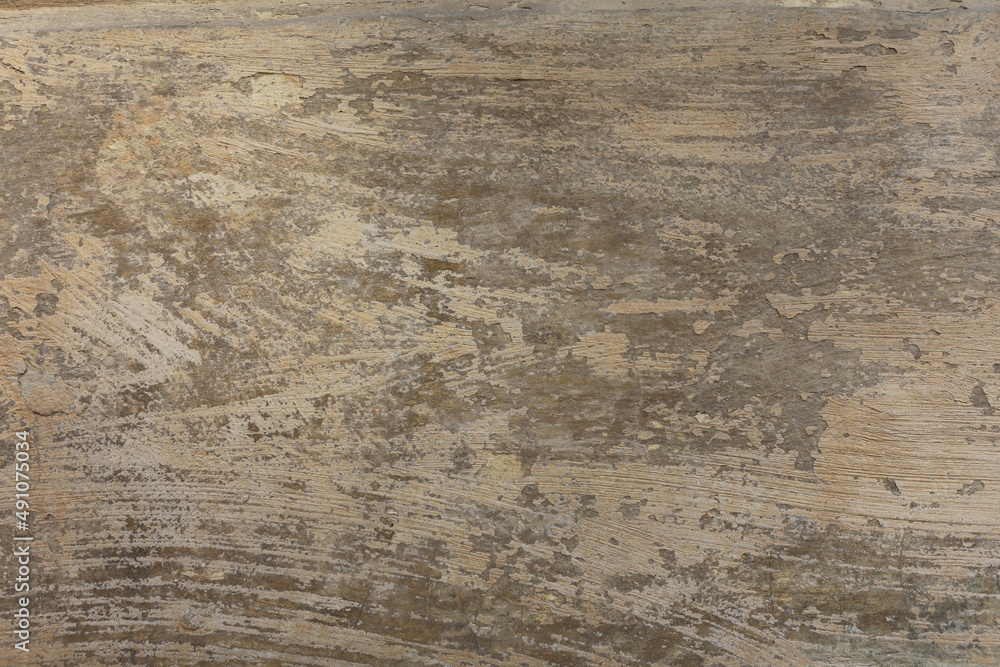 Paint brushed beige wall background with detailed texture. A concrete ...
