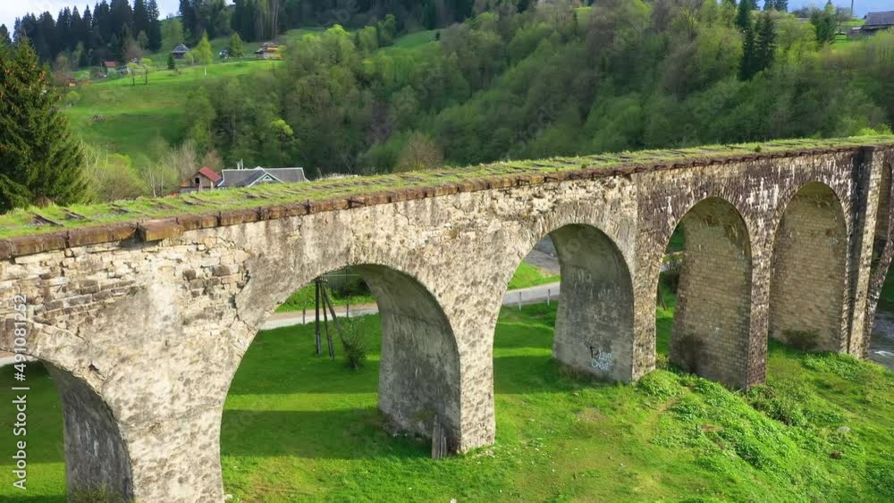 stone arched railway bridge over the Prut River in the Carpathians in ...