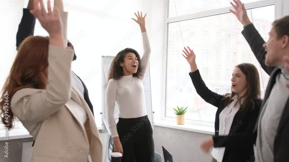 happy diverse business people putting hands together, showing support ...