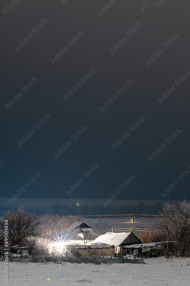 snow covered house forest in the night . Night landscape. Nightsky and ...