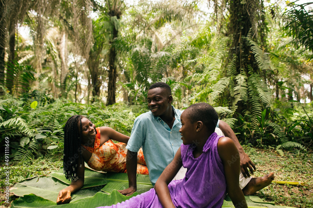 Portrait of a black african family of nature activists smiling together ...