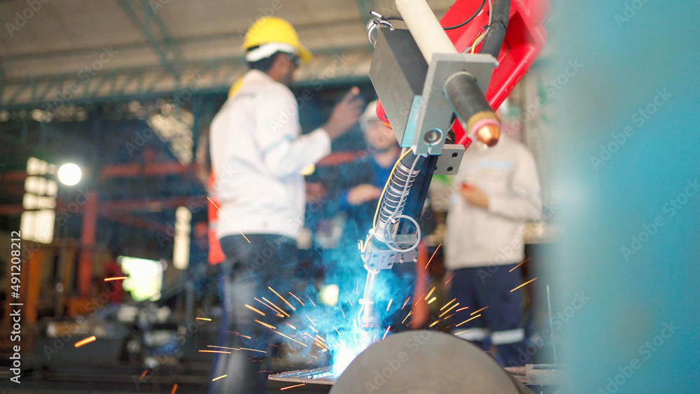 Industrial automate modern robotic welding arm machine tool welds metal ...