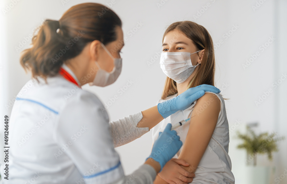 Doctor vaccinating child Stock Photo | Adobe Stock
