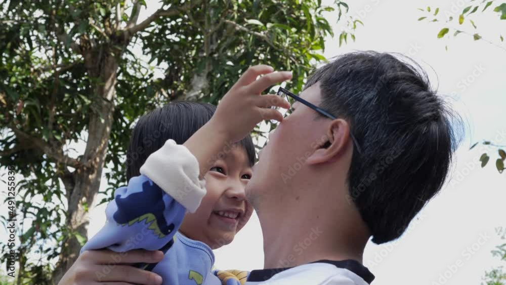 Authentic asian child boy and dad in happy moment shot, smiling and ...