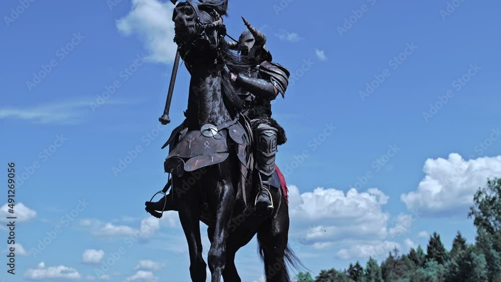 Viking. Warrior rides a horse from battle. Stock Video | Adobe Stock