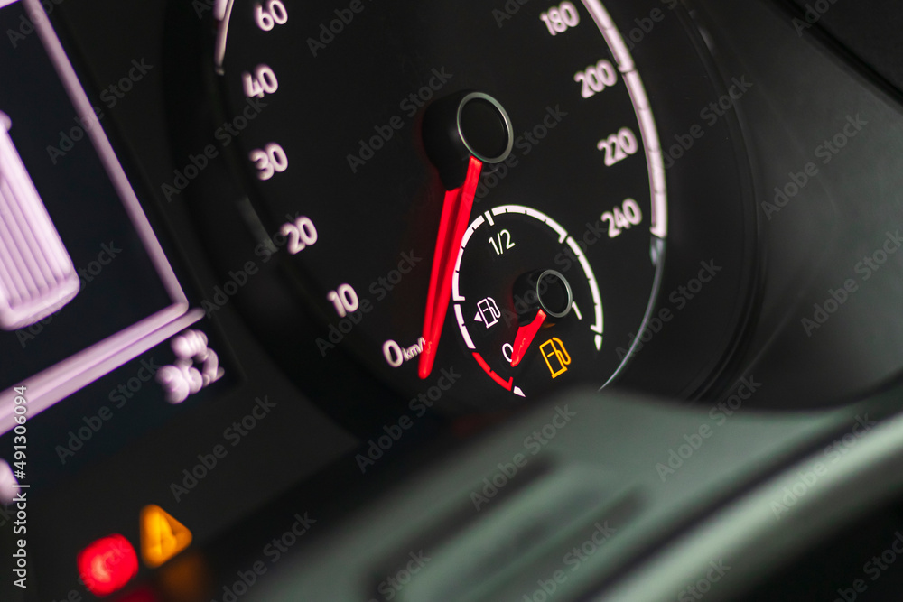 Fuel discharge warning light on the dashboard of the car. The low fuel ...