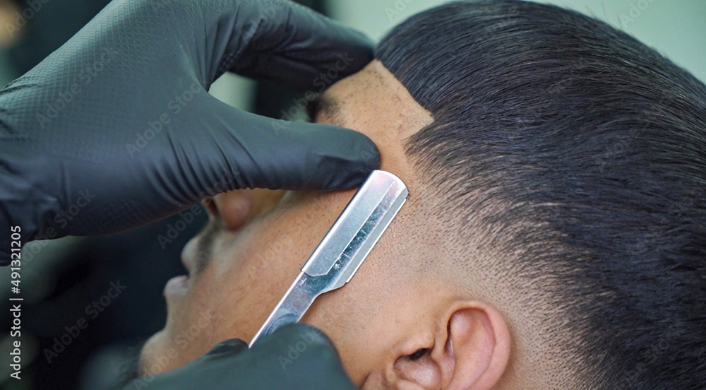 person with Razor Stock Photo | Adobe Stock