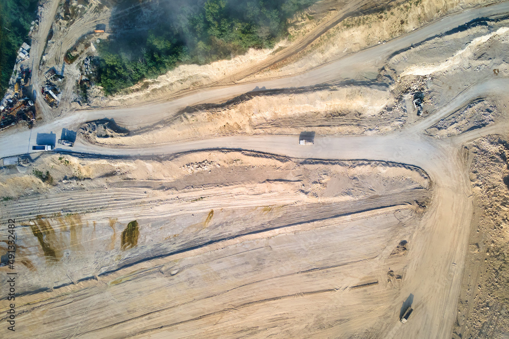 Aerial view of open pit mining site of limestone materials extraction ...