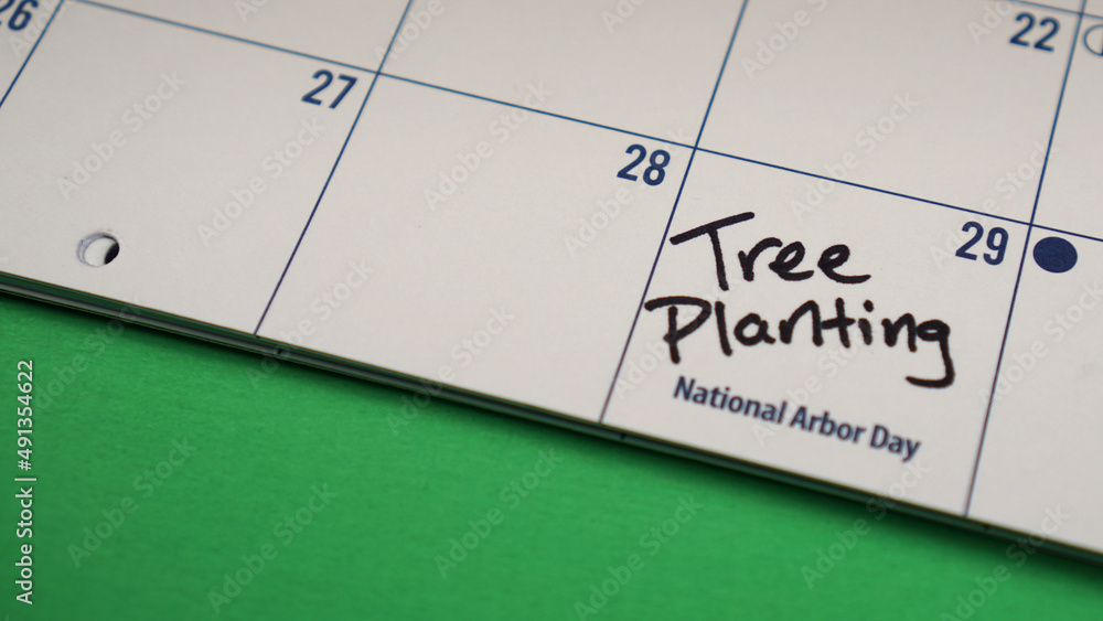 Tree planting event marked on a calendar on National Arbor Day, which ...