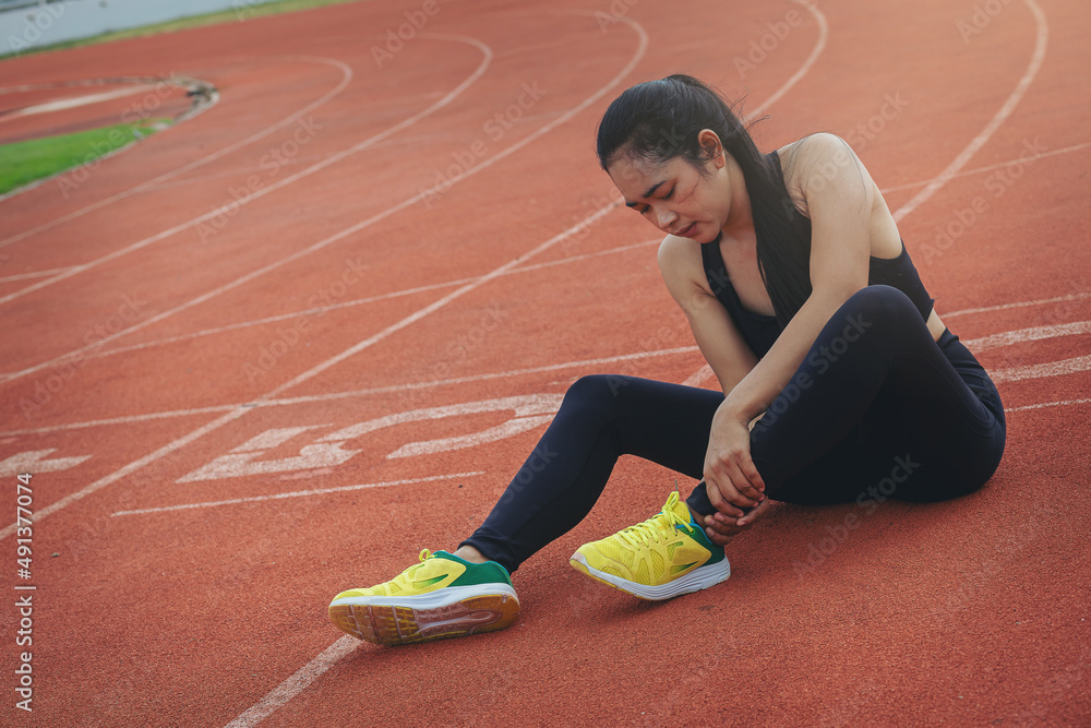Woman runner has twisted ankle injury for practice marathon run at the ...