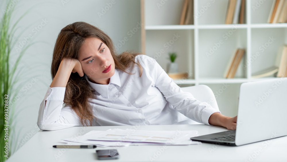 Online conference. Bored woman. Office work. Tired pretty lady in white ...
