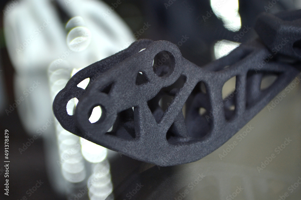 Person holding object printed on professional 3D printer. Multi Jet ...