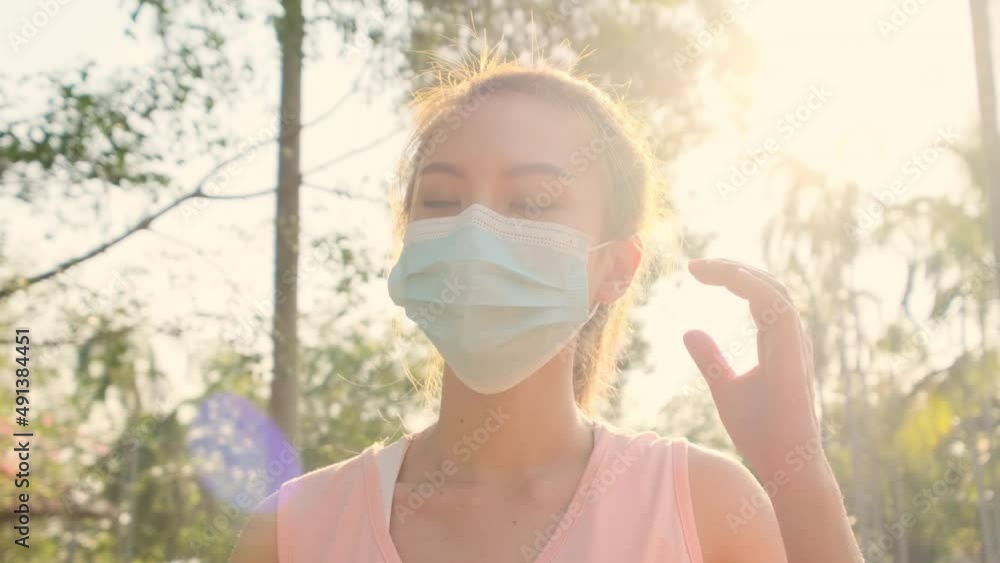 4k resolution slow motion. Young Asian woman healthy taking off medical ...