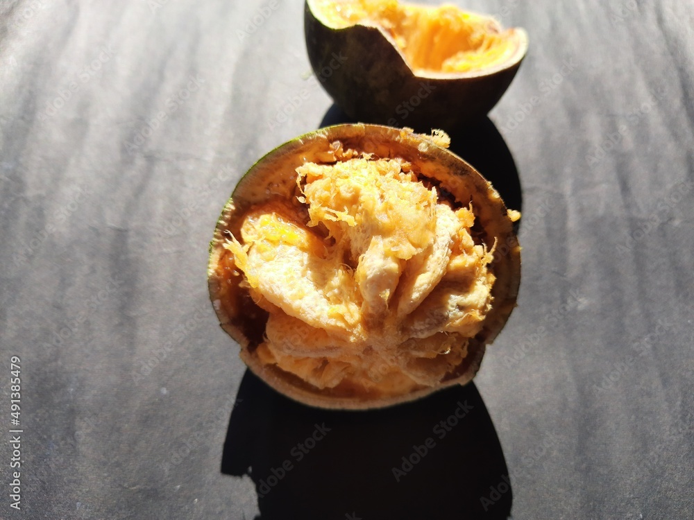 Ripe Bael fruit. Aegle marmelos commonly known as Bael. Its other is ...