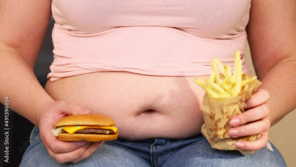 Young overweight or plus size woman with fatty, big belly and unhealthy ...