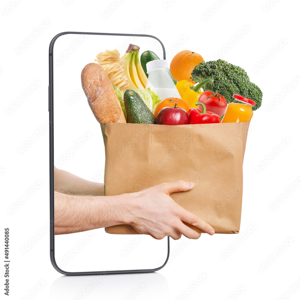 The concept of food and groceries delivery. Hands with a bag of food in ...