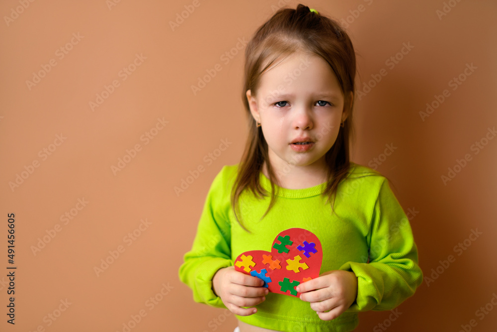 Tearful sad face of a child with a tear sliding down his cheek. The ...
