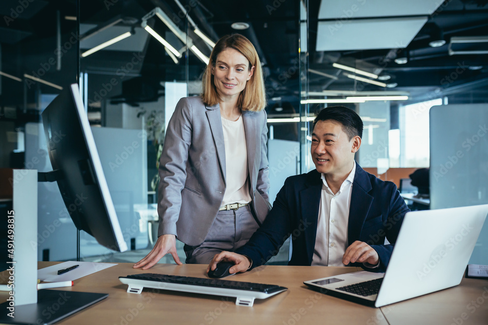 Sexual relationship and flirt at office. Young sensual Business lady seducing her busy male ...