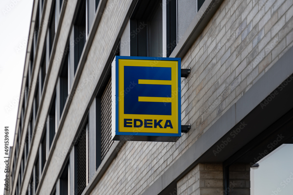 DRESDEN, GERMANY - 08. March 2022: Edeka supermarket company logo on a ...