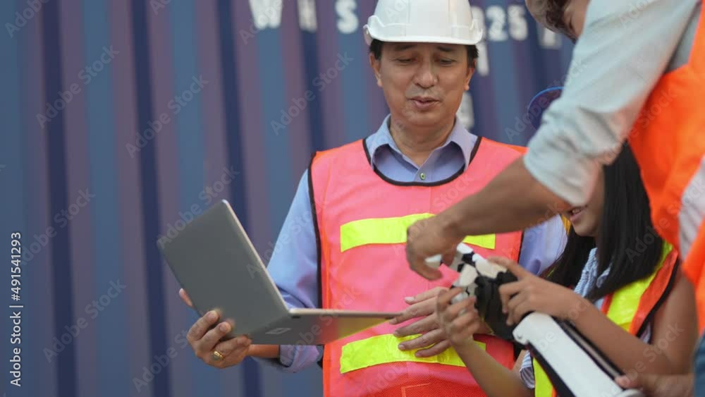 Engineer Teachers teaching a girl about robot hand In Science Robotics ...