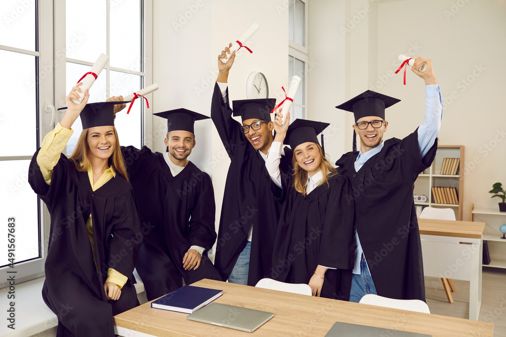 Congrats, grad. Team of happy international multiracial college or ...