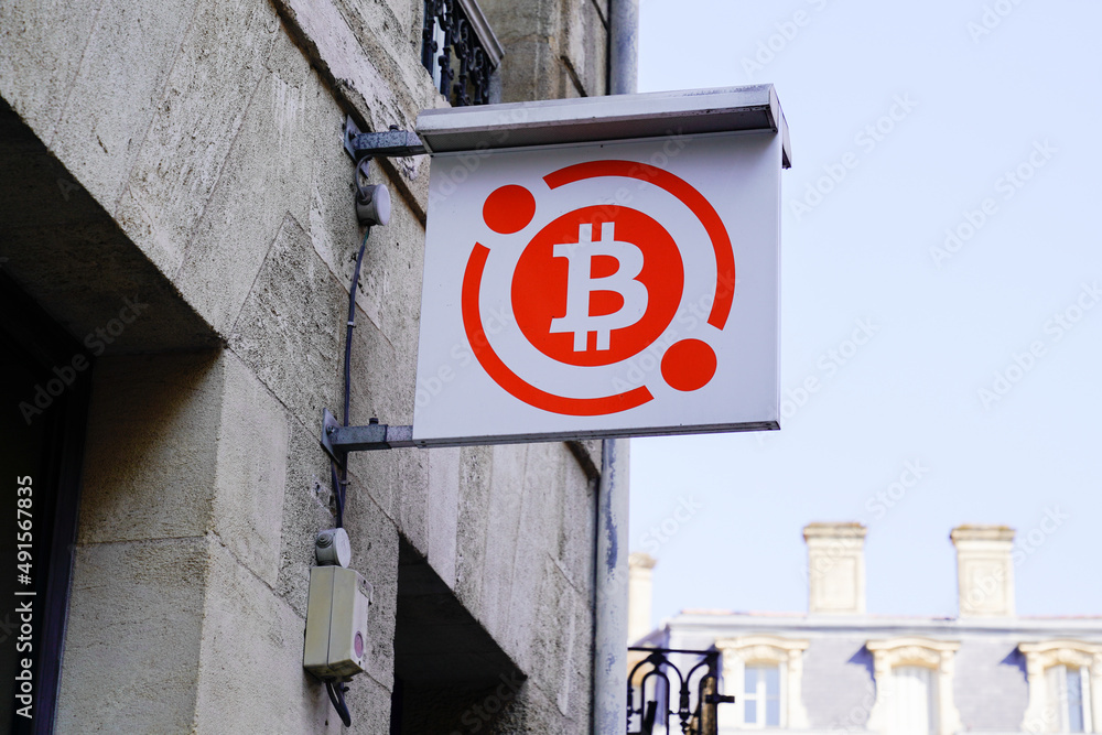 bitcoin logo brand and text sign facade on le comptoir des ...