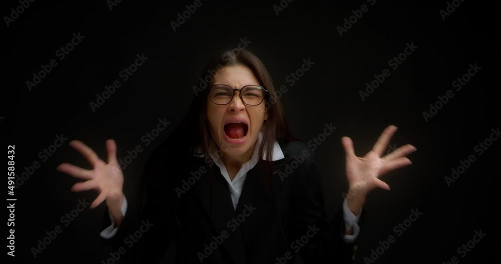 Business woman with glasses, crazy and insane, screaming with an ...