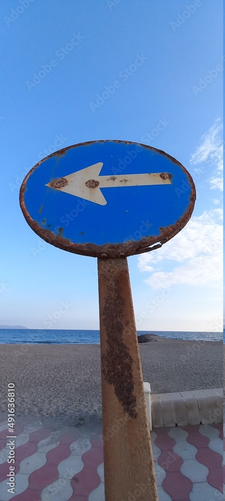 Sign on the beach. Mandatory sign. Traffic signal. Rusty road sign ...