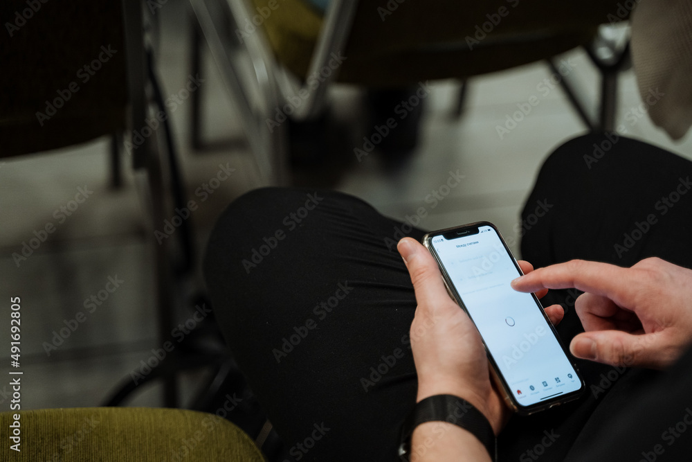 Poke your finger at the phone screen. The guy types text on his ...