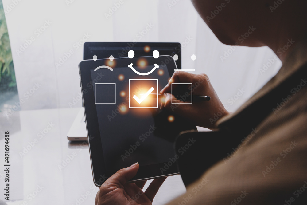 Foto de Customer service evaluation concept. Businessman pressing face ...