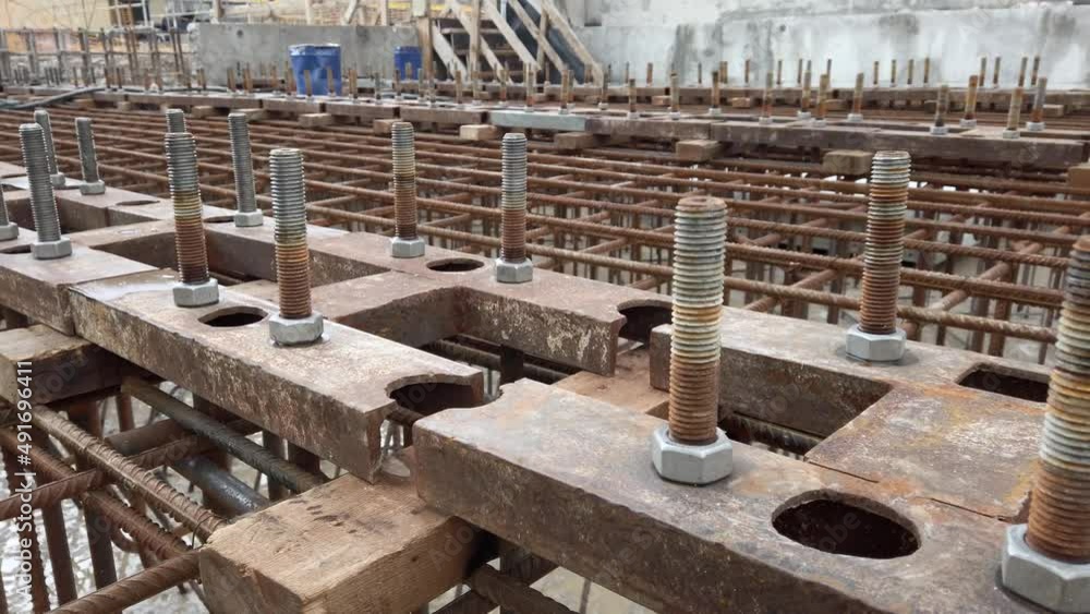 Framework of reinforced concrete foundation with metal anchor bolts ...