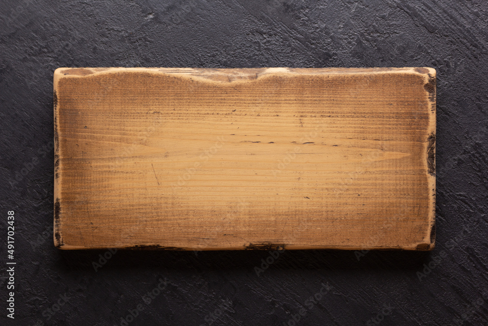 Wooden nameplate or sign board on wall background. Front view of name ...