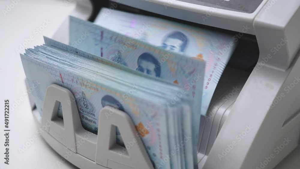 Thai Baht money counting in Machine. Paper THB Thai baht banknotes ...