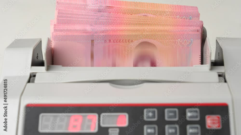 Thai Baht money counting in Machine. Paper THB Thai baht banknotes ...