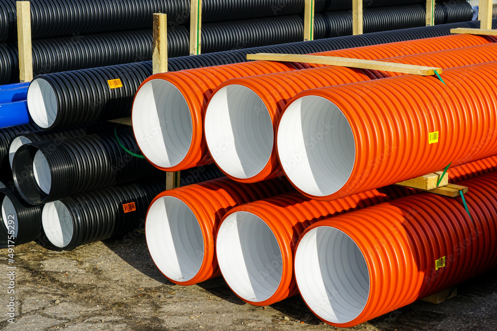 Pile of pvc sewer pipes of large diameter with outer corrugated wall ...