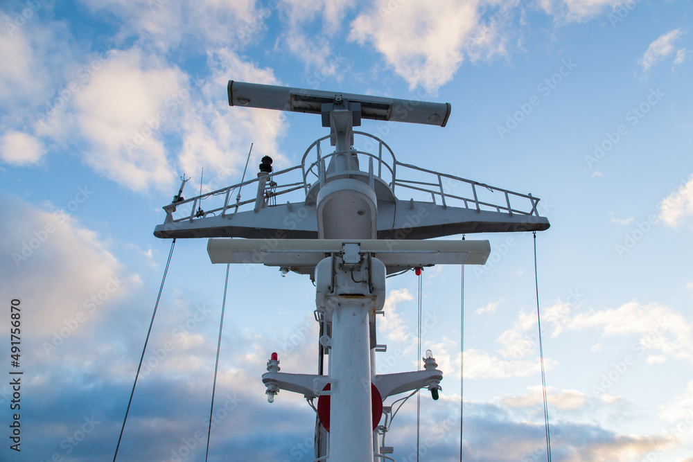 Mast of a cargo ship with navigation equipment bottom view. Radar ...