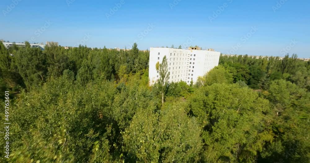 FPV drone shot flying passing a ferries wheel and overlooking the city ...