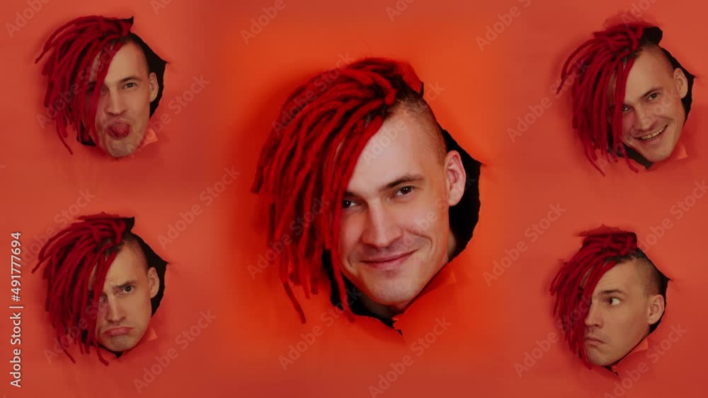 Man with dreadlocks looking through hole in paper background. Funny ...