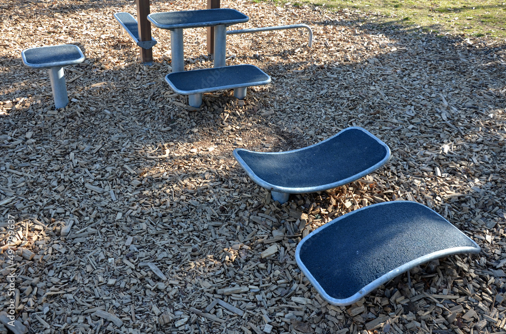 outdoor gym in the yard with stone sandstone wall and flexible rubber ...